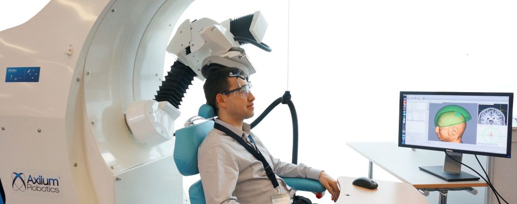 A robot to assist in transcranial magnetic stimulation (TMS / rTMS ...